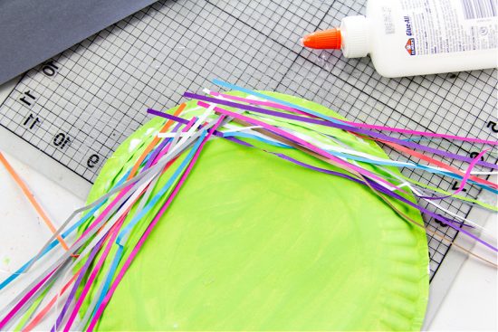 Make a Bright and Colorful Paper Plate Witch Mask - Make and Takes