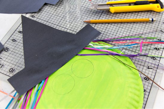 Make a Bright and Colorful Paper Plate Witch Mask - Make and Takes